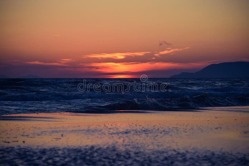Sunset stock image. Image of tuscan, island, sunset, clouds - 76425011