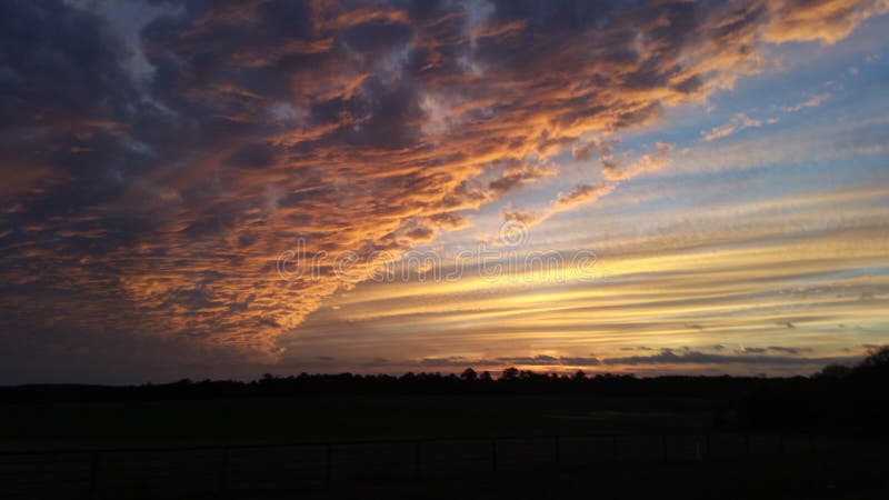 Sunset 2 Types of Clouds stock photo. Image of sunset - 158809716