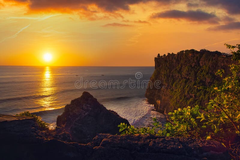 Sunset at Uluwatu temple stock image. Image of bali - 214214455