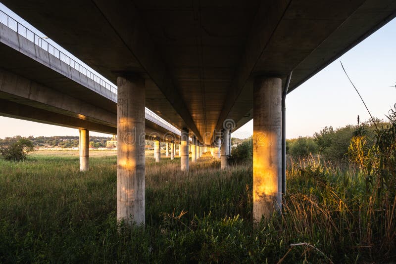 Sunset under the bridge stock image. Image of construction - 238106961