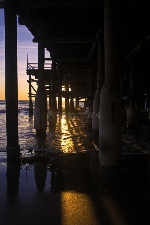 Sunset under a pier stock photo. Image of glow, ocean - 78347046