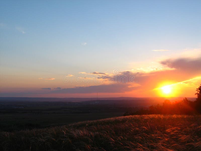 Sunset over the flatland stock photo. Image of evening - 234273152
