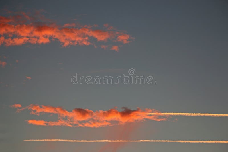 Sunset and vapour trails stock image. Image of pink, shine - 91776859