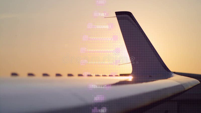 Sunset View of Airplane Wing with Digital Data Animation Overlay in Sky ...