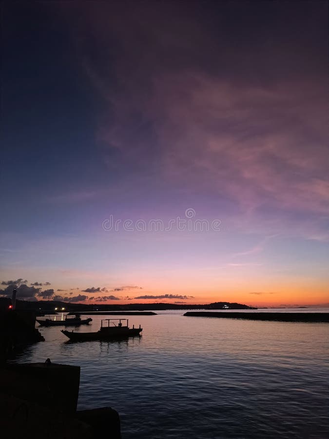 Sunset View on the Beach with Fishing Boats and Breakers Stock Image ...