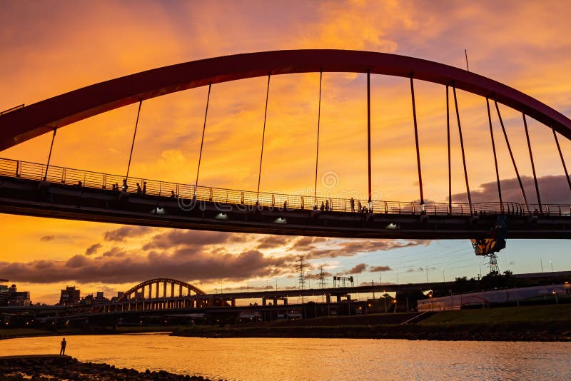 Sunset View of the Beautiful Rainbow Bridge Stock Photo - Image of city ...