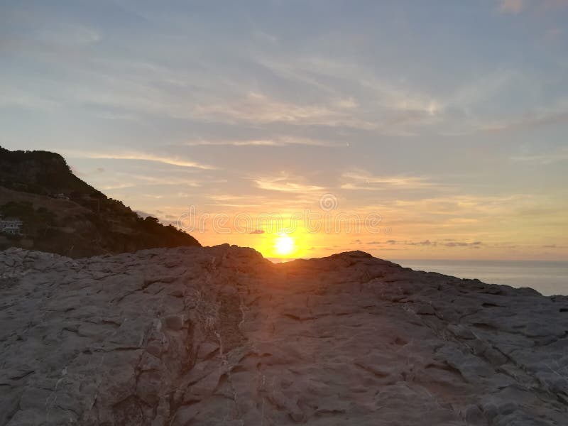 Sunset view from cliff stock photo. Image of beach, boat - 189408072