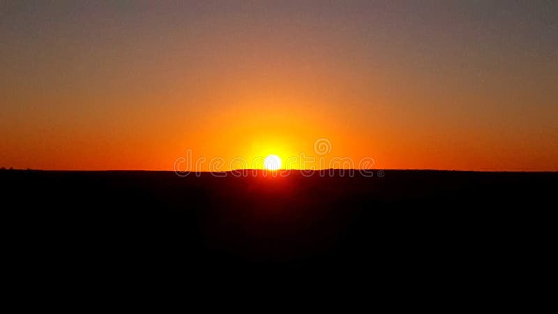Sunset view from desert stock photo. Image of sunrise - 150459842