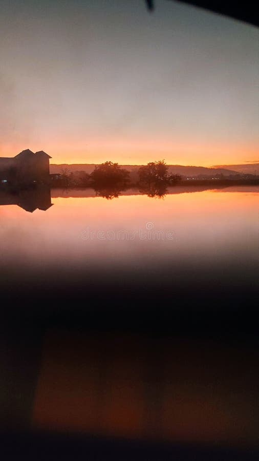 Sunset View in the Evening with the Reflection of the Shadow in the ...