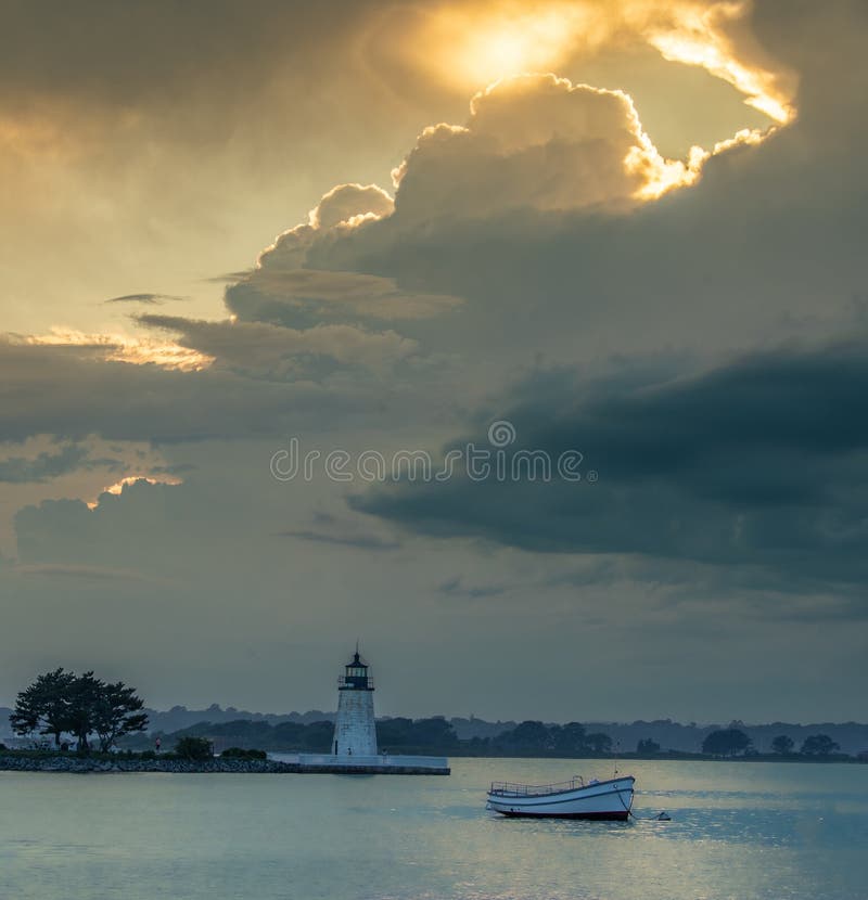 Sunset View of a Lighthouse and a Boat Editorial Stock Image - Image of ...