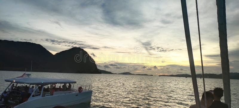Sunset view at 7pm stock photo. Image of boat, beach - 240547328