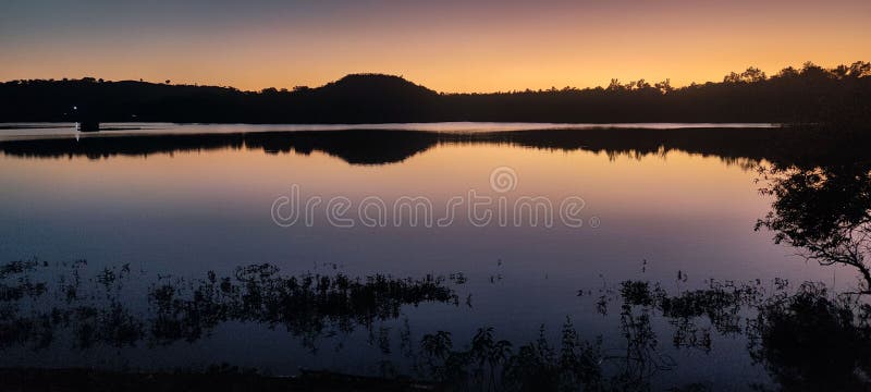 Sunset View from the Pond and Dark Trees. Stock Photo - Image of water ...