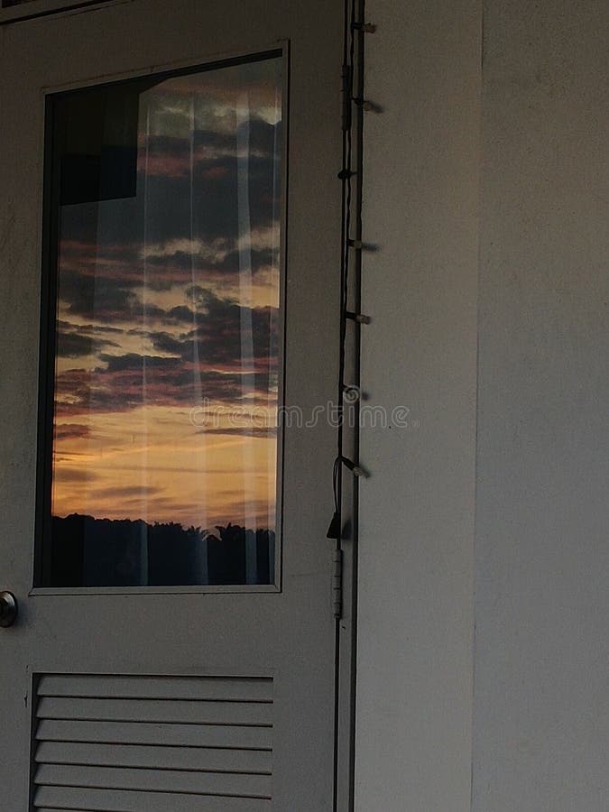 Sunset View, Reflection of Sunset from the Door. Stock Photo - Image of ...