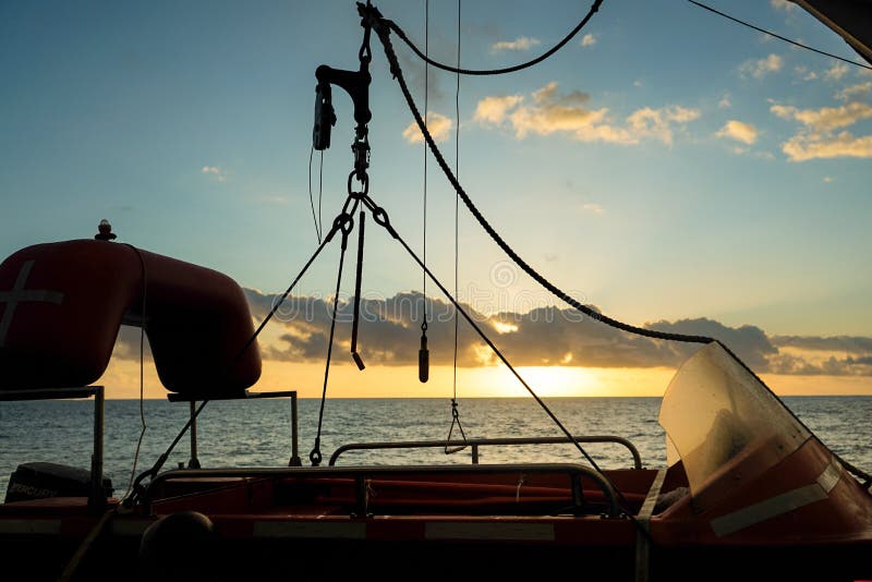 Rescue boat stock photo. Image of silhouette, sunset - 239530496