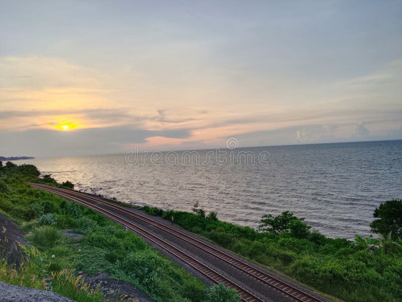 The Sunset View is Set on the Beach Co-goring with the Railroad Tracks ...