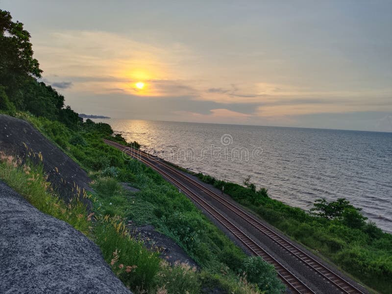 The Sunset View is Set on the Beach Co-goring with the Railroad Tracks ...