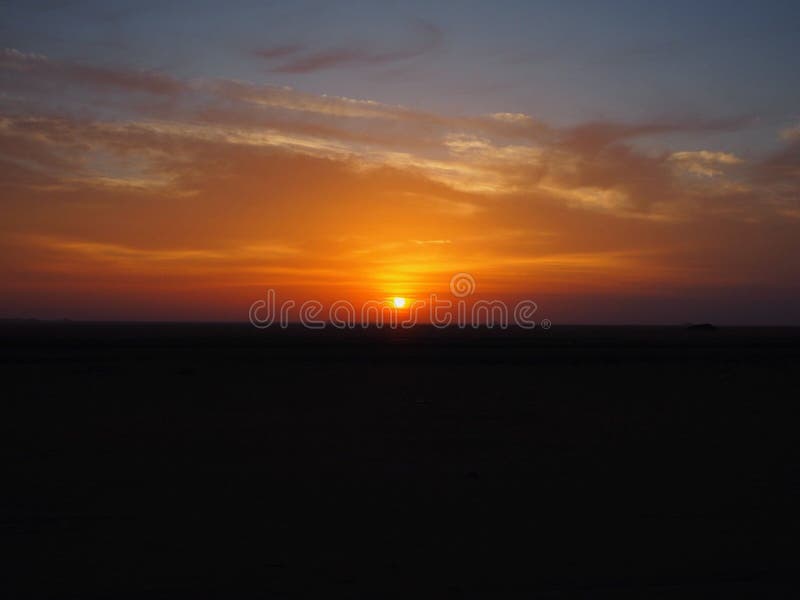 Sunset View with the Sun Setting Behind Mountain Making Clouds and Sky ...