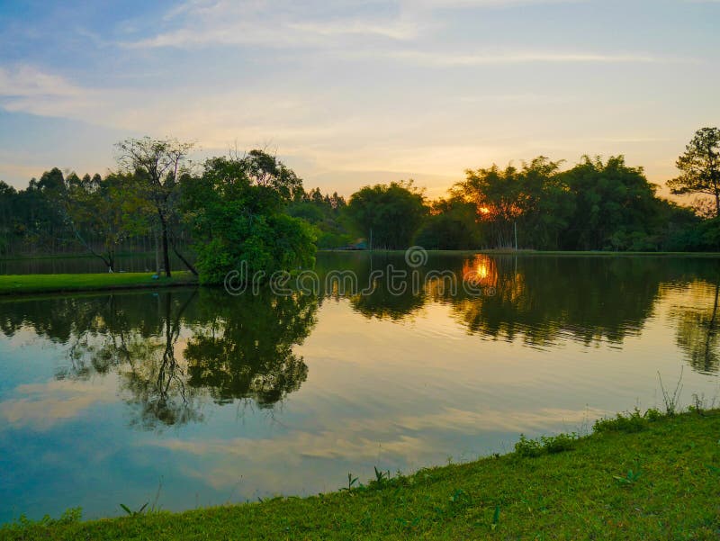 Sunset View with Trees and Sky Reflecting in the Lake Stock Image ...
