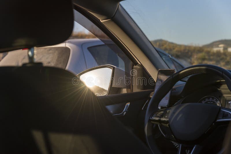 Sunset Viewed from Inside a Car Interior in the Mirror Sun Stock Image ...