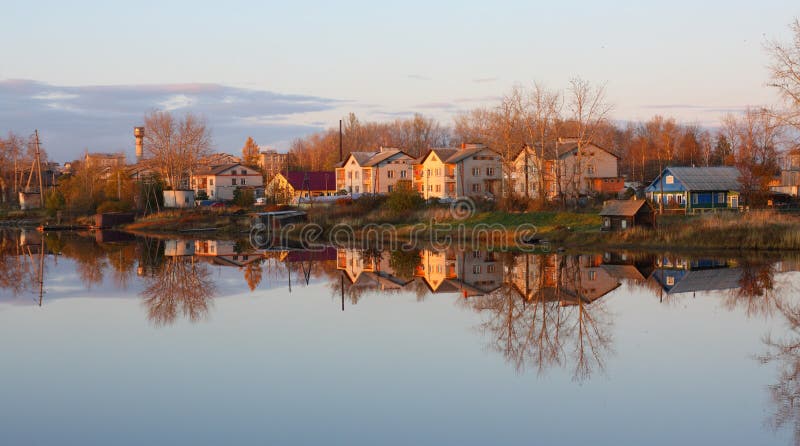 Sunset in a village. stock photo. Image of mirrored, sunset - 12010986