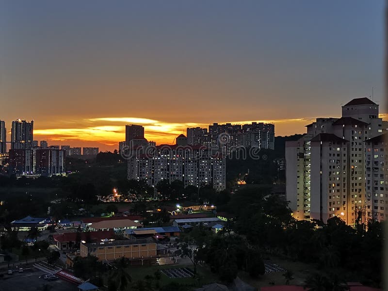 Sunset in Village in High Rise Building Stock Image - Image of evening ...