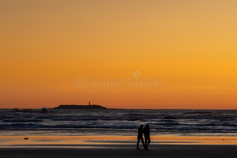 Sunset Walk on the Beach stock photo. Image of clouds - 162639504