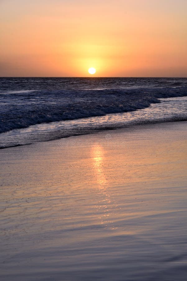Sunset walk on the beach stock image. Image of water - 175596237