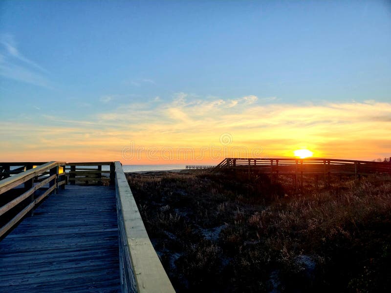 A Sunset Walk to the Beach stock photo. Image of dock - 174706068