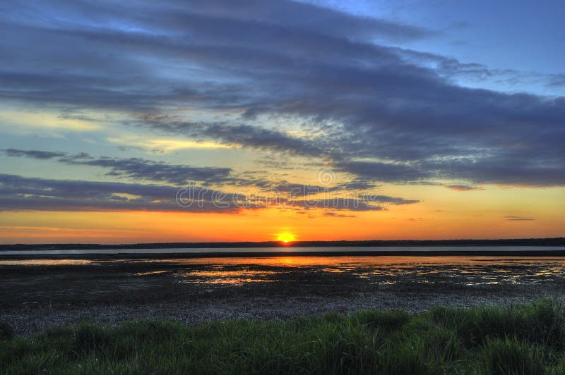 Sunset on the Water stock image. Image of shoreline, coastline - 19868603