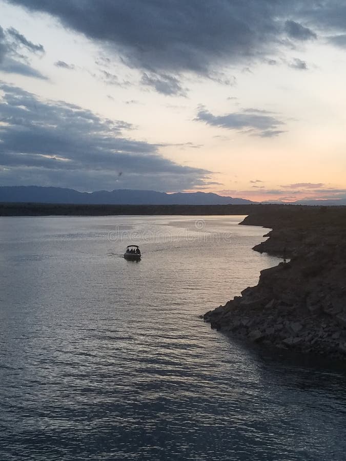 Sunset water stock photo. Image of grass, water, shore - 131634908