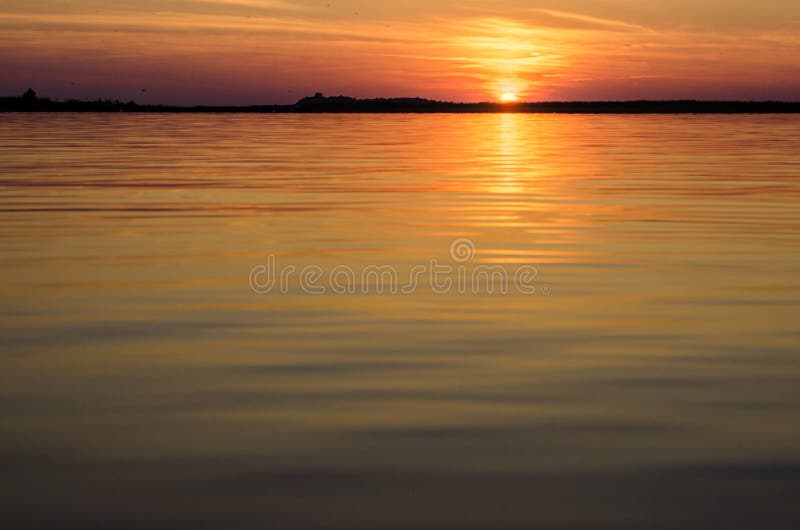 Sunset in the water. stock photo. Image of orange, dawn - 99505832