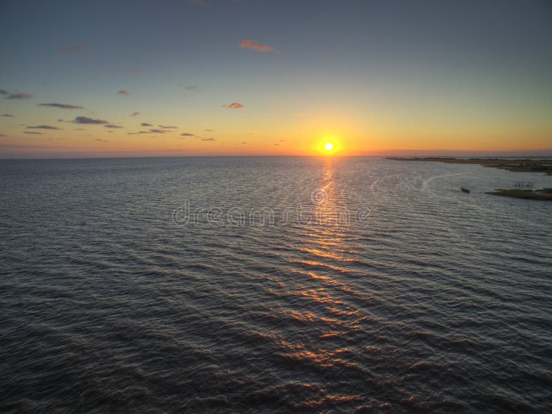 Sunset on the Water stock image. Image of shoreline, coastline - 19868603