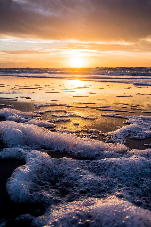 Sunset and Water Reflection on Beach Stock Image - Image of clouds ...