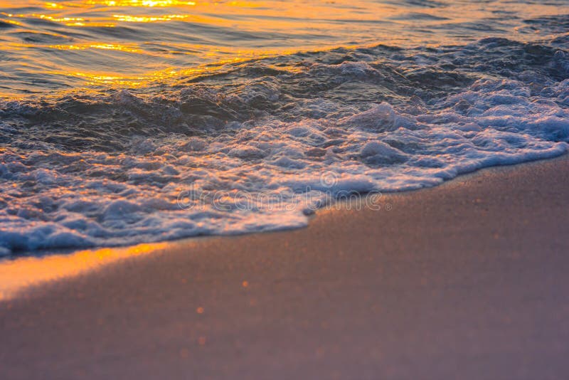 Sunset, wave and sand stock image. Image of sunset, young - 52331643