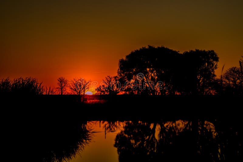 Sunset stock image. Image of horizon, calm, mirror, water - 78407301