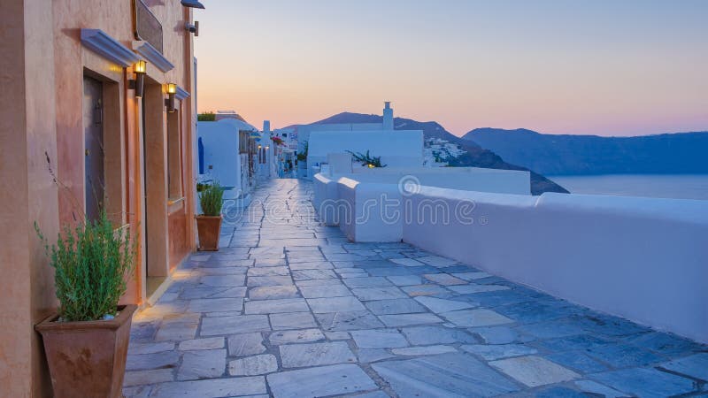 Sunset with White Churches an Blue Domes by the Ocean of Oia Santorini ...
