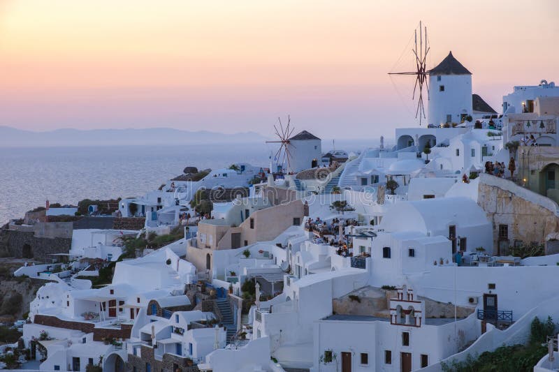 Sunset with White Churches an Blue Domes by the Ocean of Oia Santorini ...