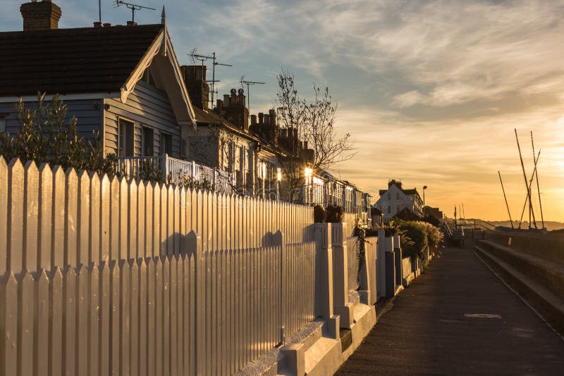 Sunset in Whitstable stock photo. Image of fence, promenade - 47523092