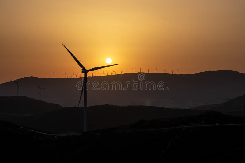Sunset with wind turbines stock photo. Image of beautiful - 193660038