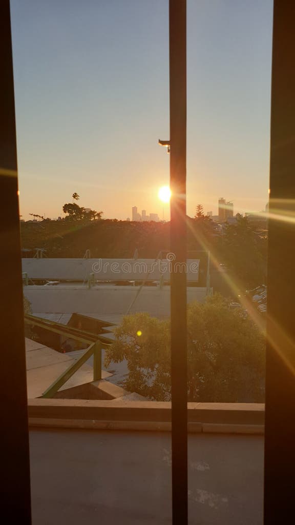 Sunset through Window stock image. Image of wall, yellow - 183491583