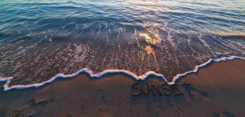 Sunset written in the sand stock photo. Image of cloudscape - 87964208