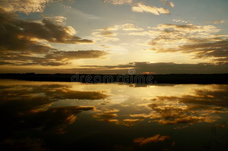Sunset with Reflection Over Water Stock Image - Image of paddy ...