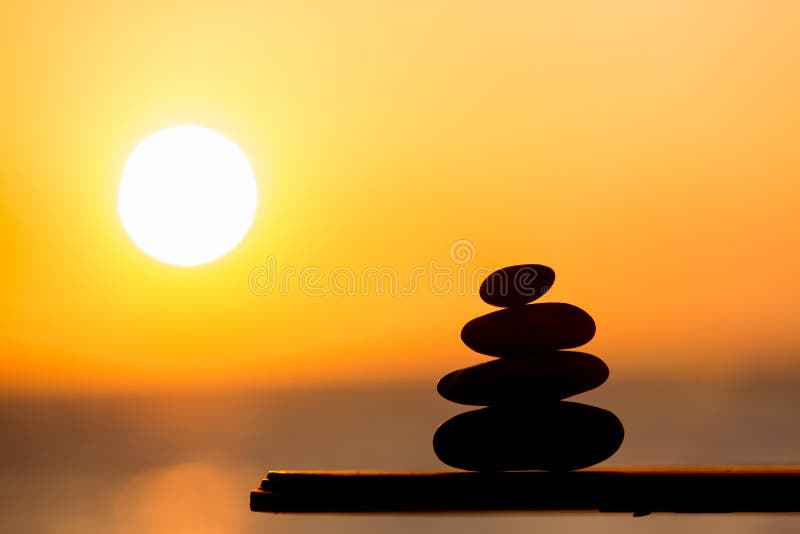 Sunset and zen stones stock photo. Image of outdoors - 36342938