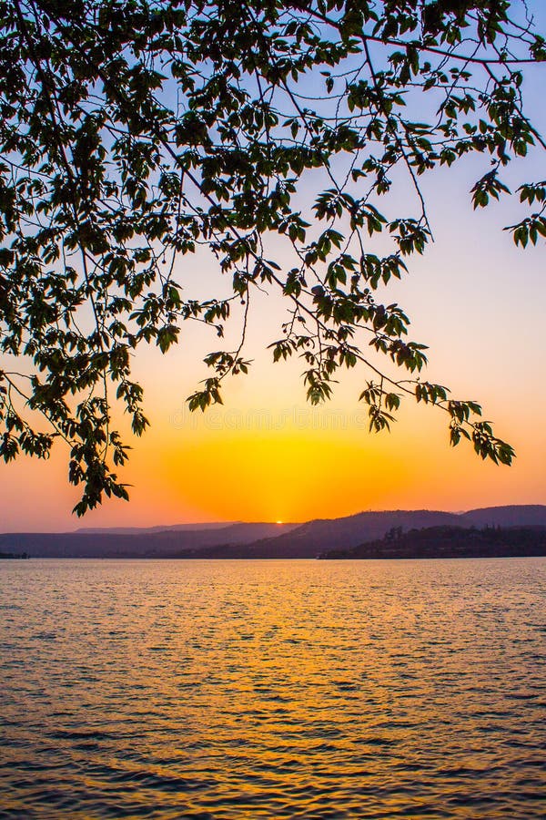 Sunsets Sun Light Orange Colour Mountain Stock Image - Image of water ...