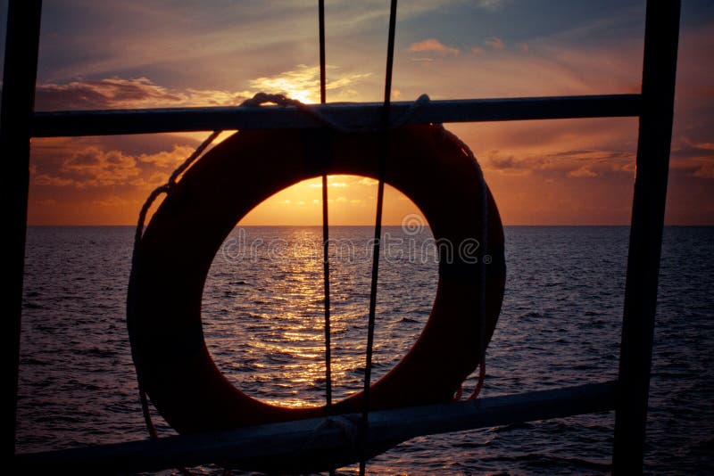 The Sunsets View from Behind the Safety Ring Float Stock Image - Image ...