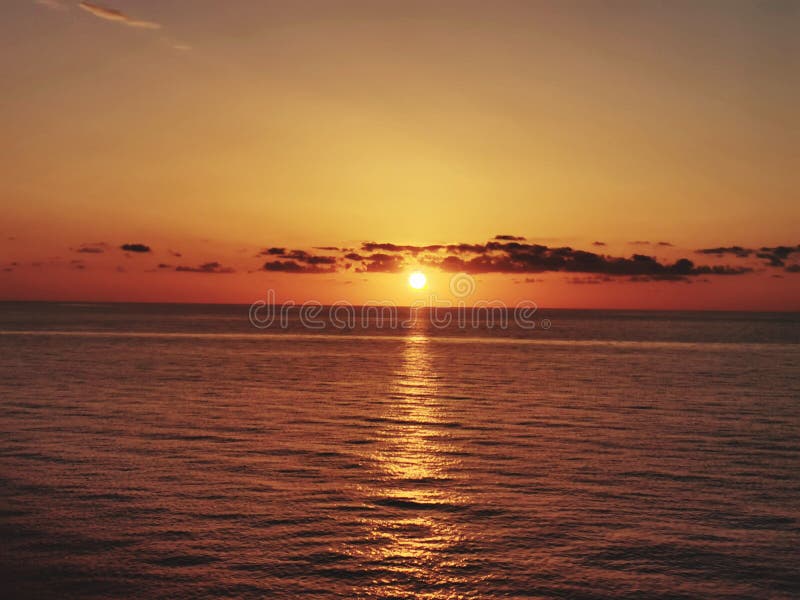 Sunsett in the sea stock photo. Image of afterglow, sunrise - 238130960