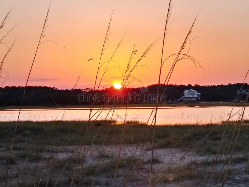 Sunsetting stock photo. Image of marsh, water, house - 165496368