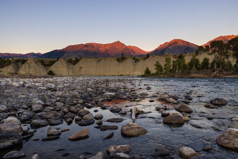 Sunsetting on Mountain Peaks in the Background Calm River and Large ...