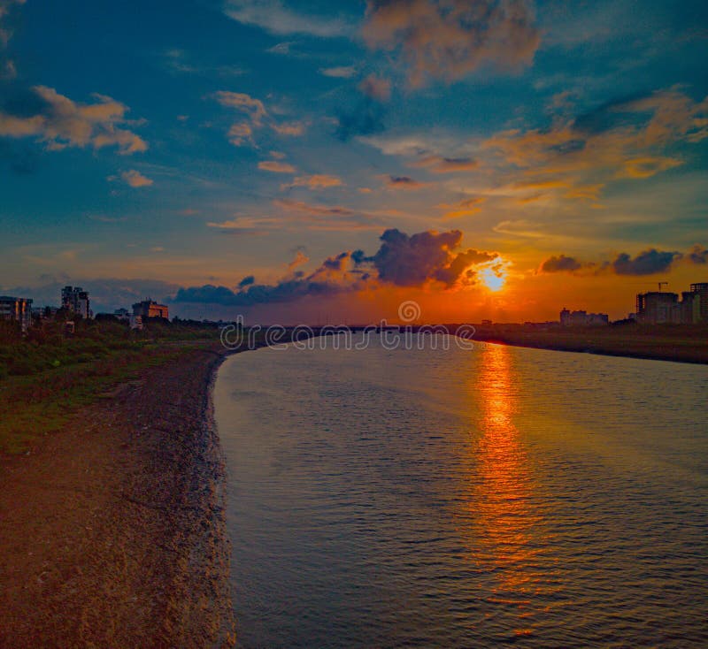 Sunsetting near the river stock image. Image of evening - 196353887