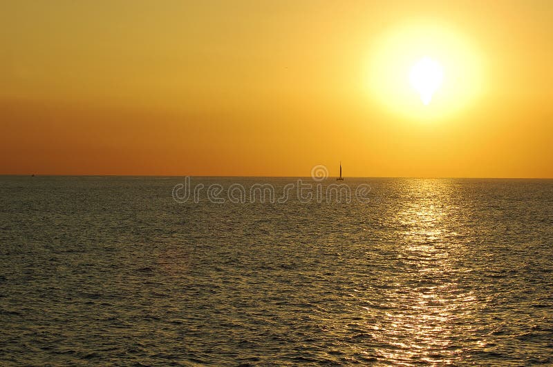 Sunsetting on the Pacific stock image. Image of sail - 22689859
